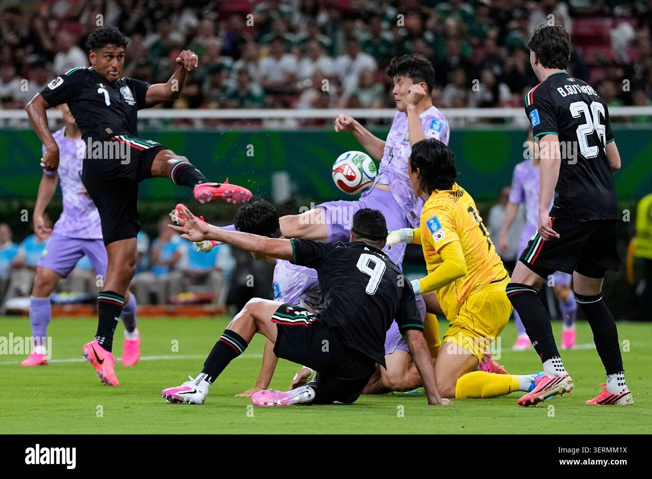 Mexico's Luis Romo (7), left, scores the opening goal during the World ...