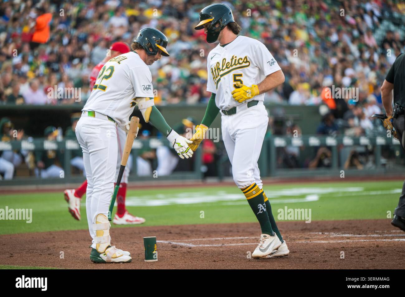 Athletics' Jacob Wilson (5) celebrates with Athletics Jeff McNeil (22 ...