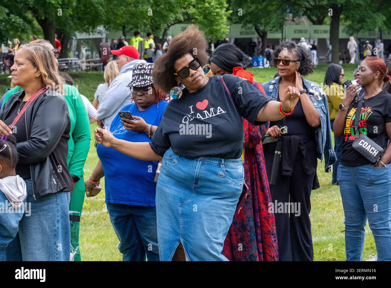 A woman dances at the opening of the Obama Presidential Center at a ...