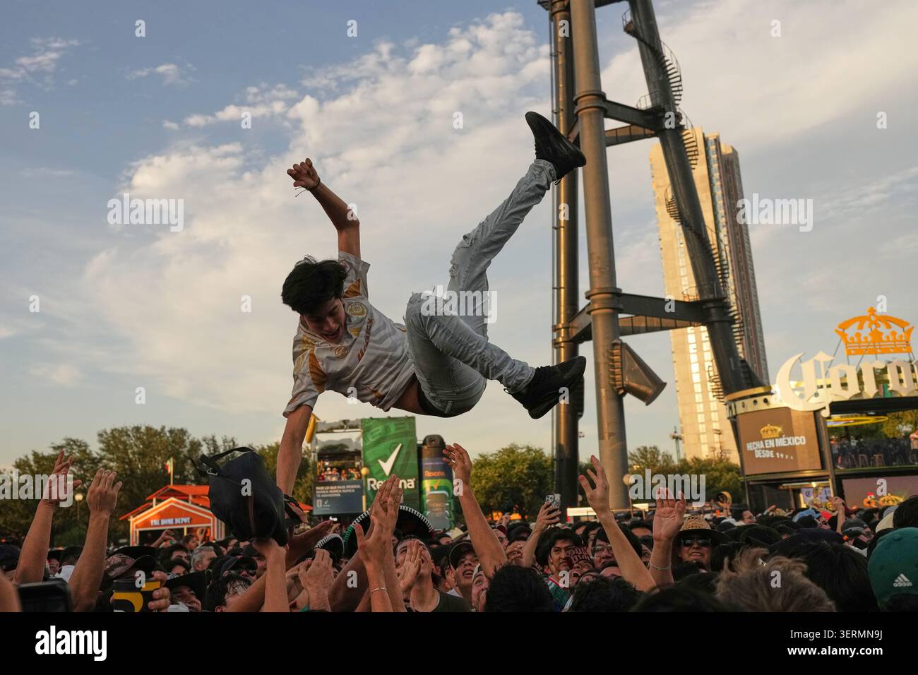 A fan is thrown into the air at the Fan Zone prior to the World Cup ...