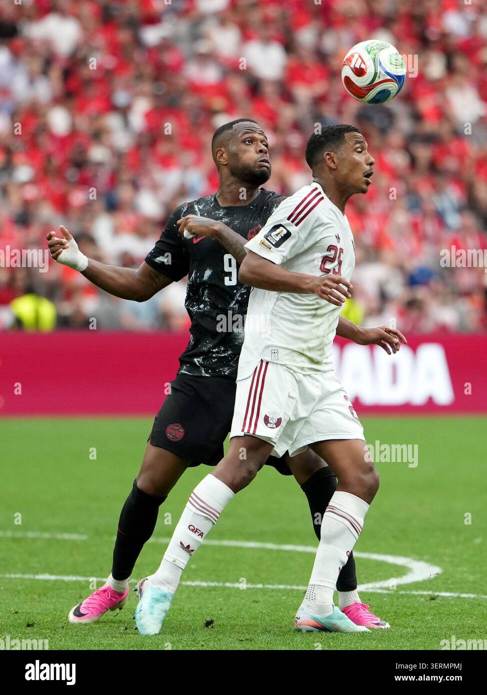 Canada's Cyle Larin (9) looks on as Qatar's Alhashmi Alhussein (25 ...