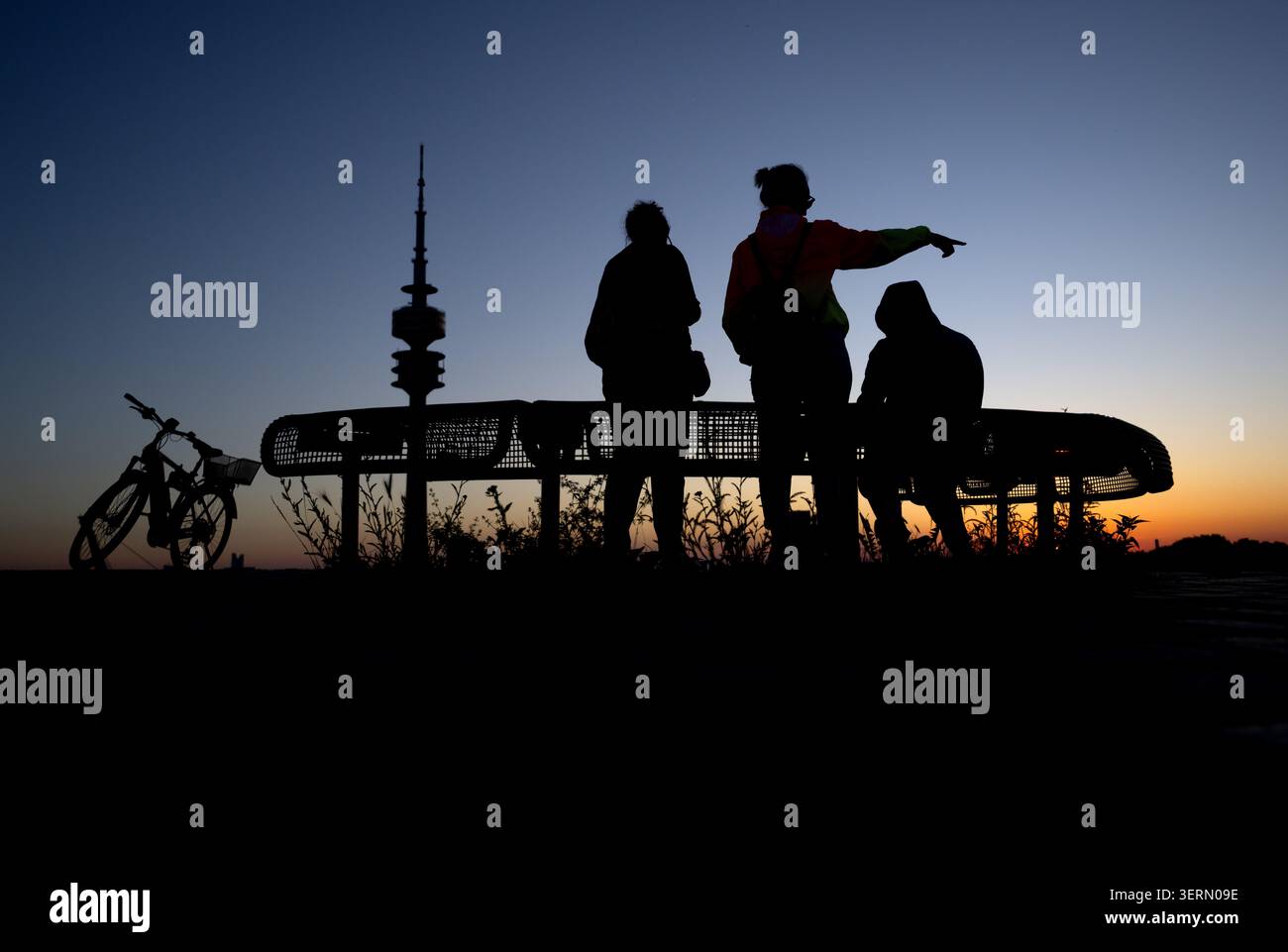 19 June 2026, Bavaria, Munich: Early risers watch the sunrise on ...