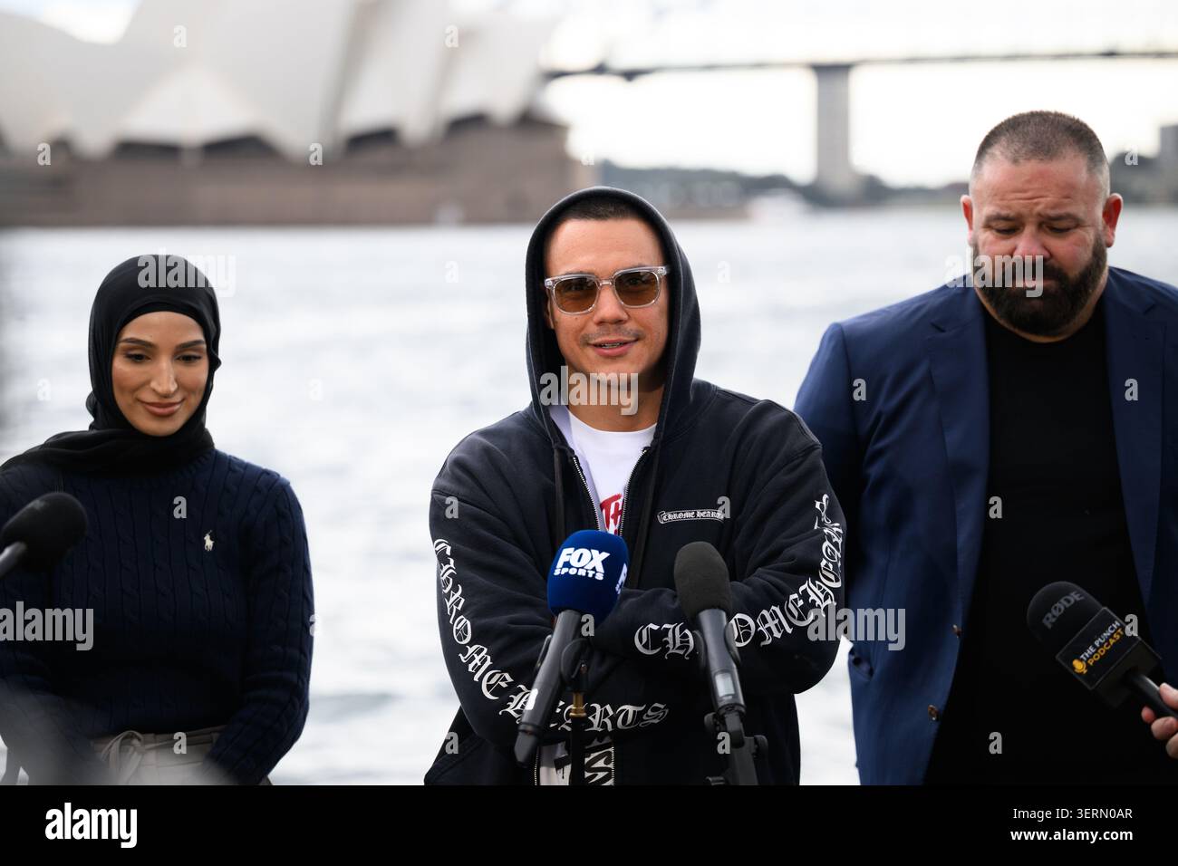 Australian boxer Tim Tszyu (centre) speaks to media during a press ...