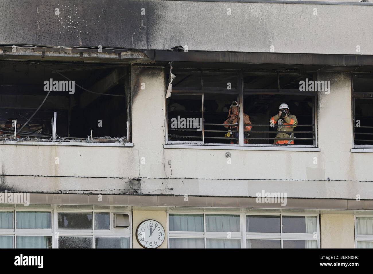 Firefighters work at the site of a fire at an elementary school in ...