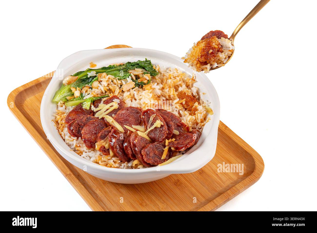 Cantonese claypot rice with sliced Chinese sausage, spoon lifting ...