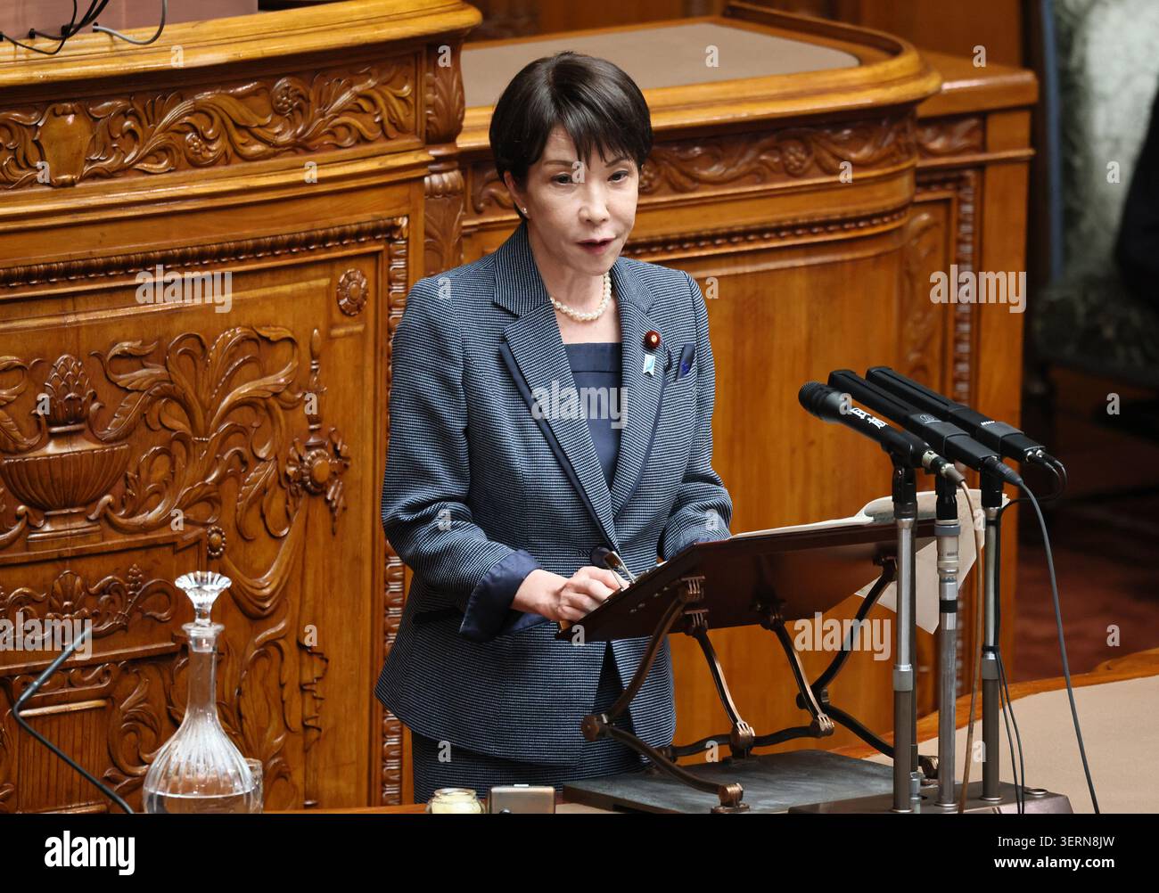 Japanese Prime Minister Sanae Takaichi responds to questions in the ...