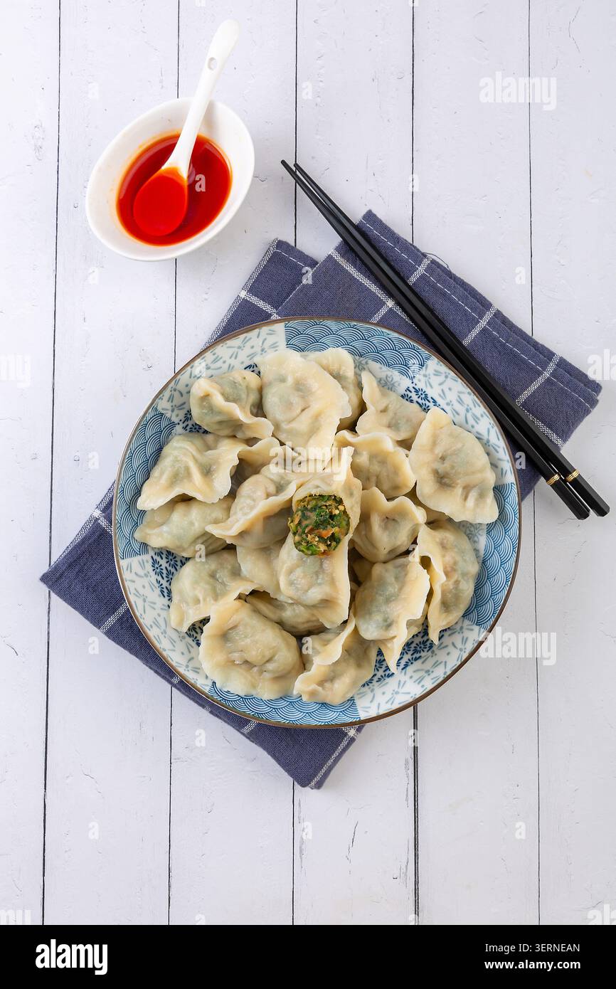 Steamed Chinese pork and shepherd's purse dumplings Jiaozi on ...