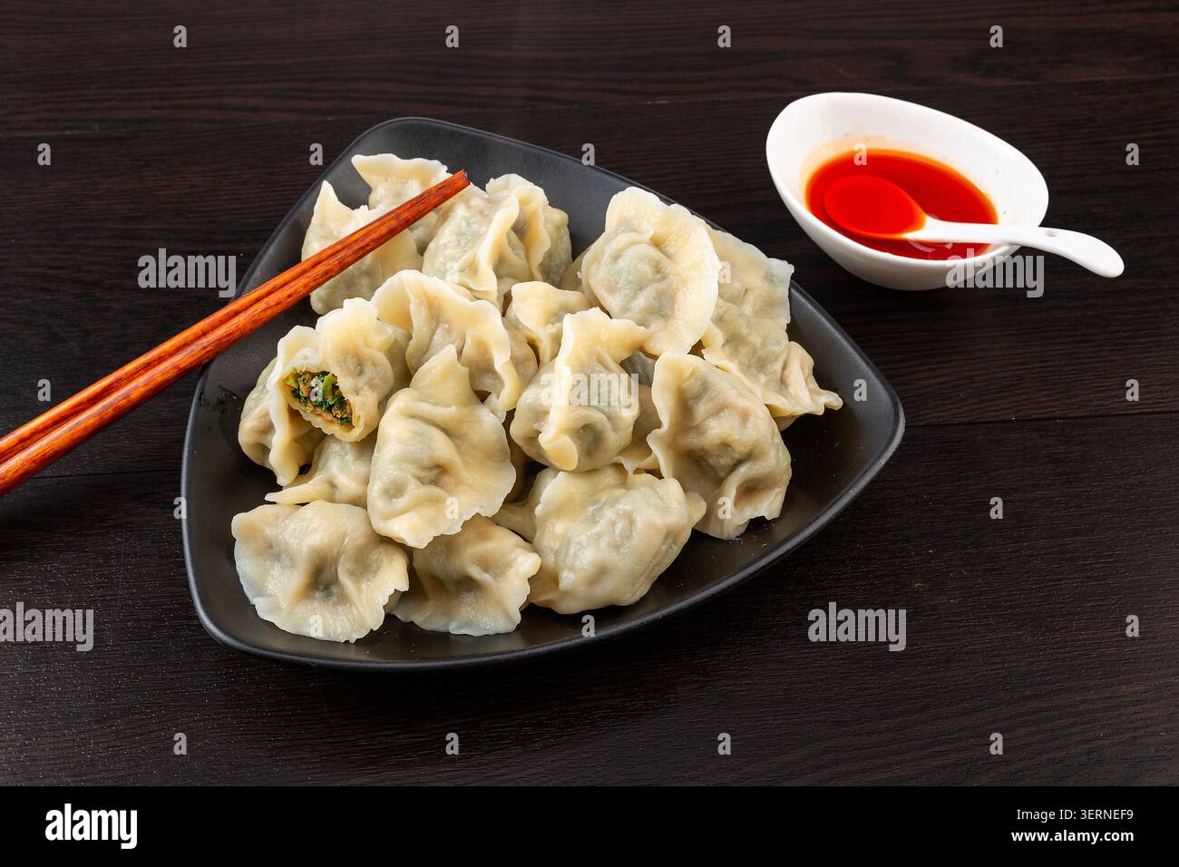 Steamed Chinese pork and shepherd's purse dumplings Jiaozi on ...
