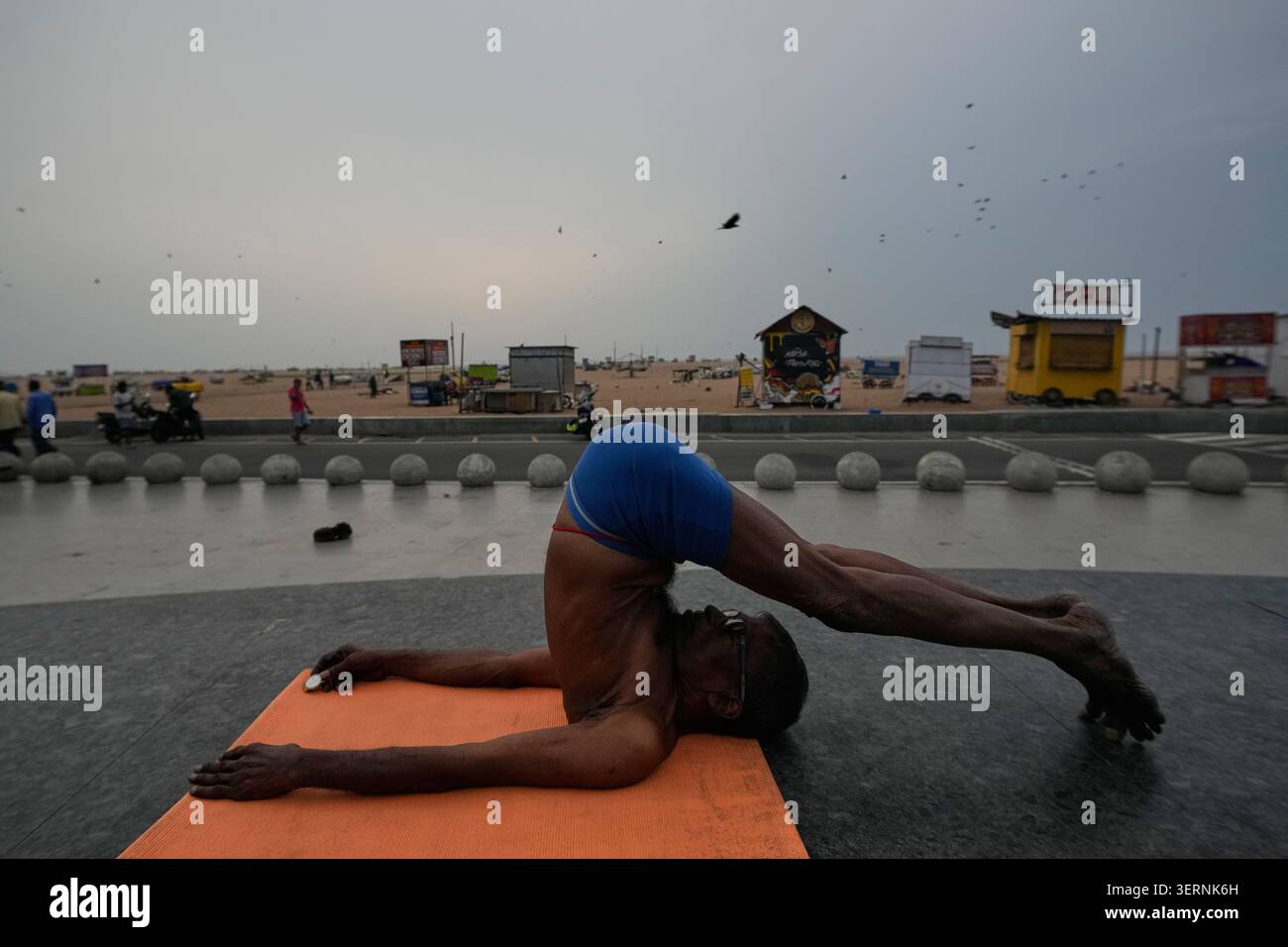 A participant practices Yoga ahead of International Day of Yoga at the ...