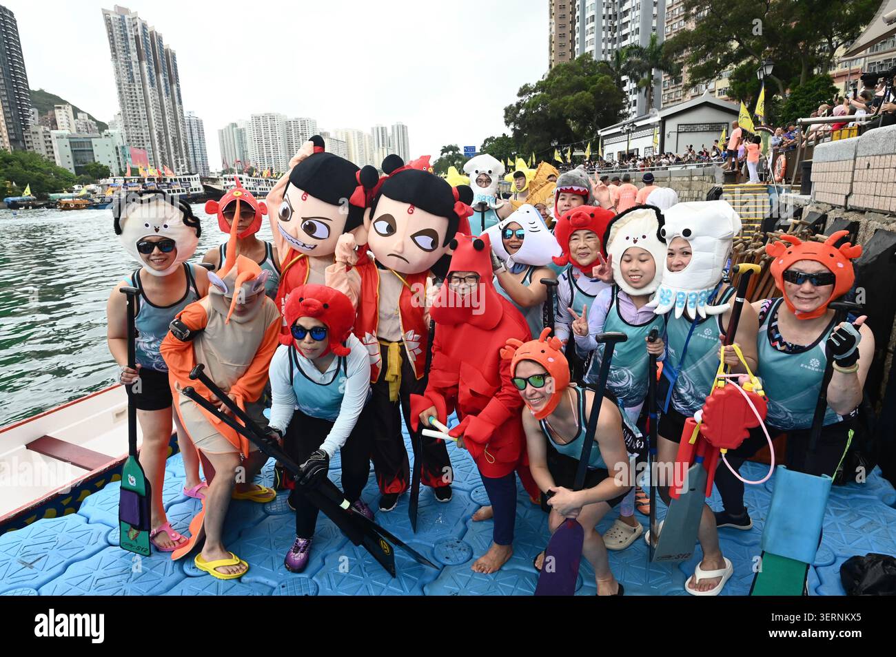 Cosplayers cosplaying Ne Zha and Seafood posing photo on a dragon boat ...