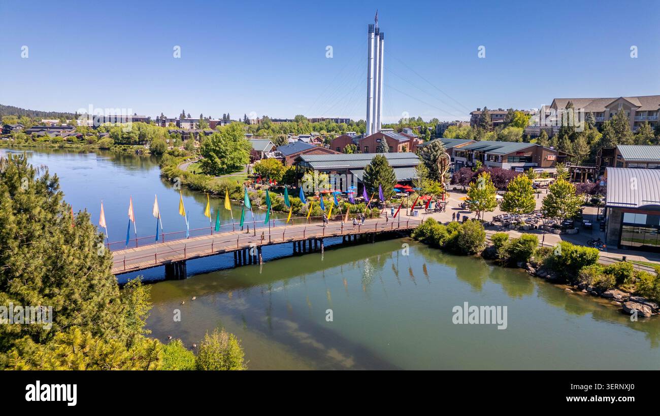Pedestrian footbridge crosses the Deschutes River in the Old Mill ...