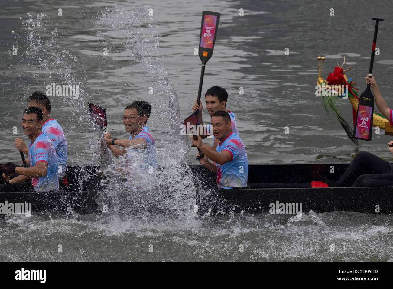 Performers cheer after a demonstration ahead of Dragon Boat Races to ...