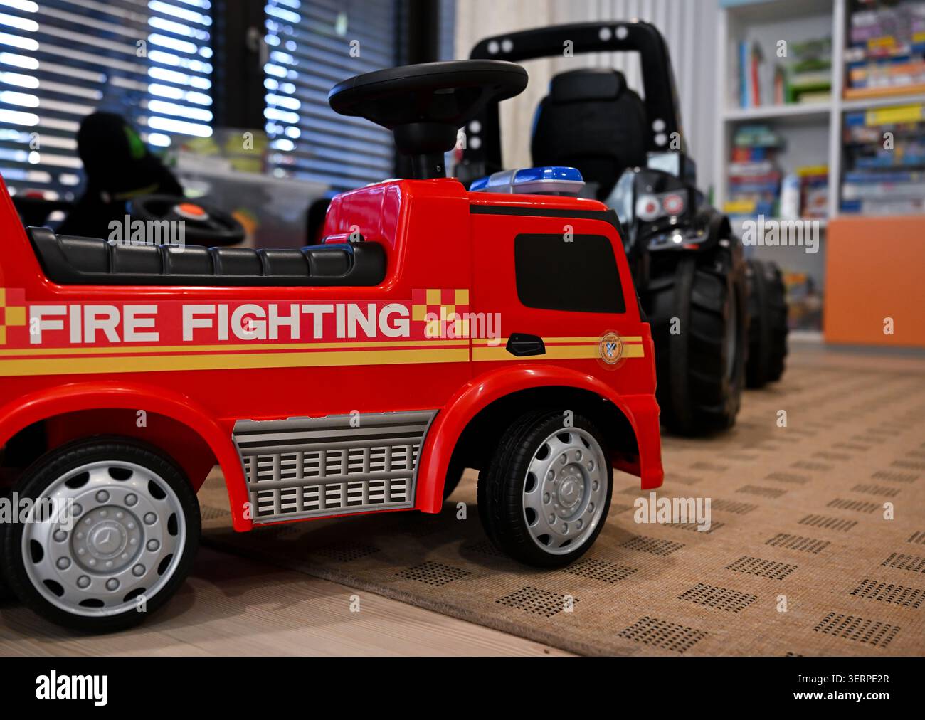 PRODUCTION - 19 June 2026, Bavaria, Munich: Pedal cars are set up in a ...