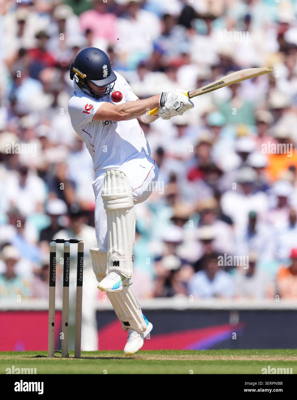 England's Matt Fisher is hit by a bouncer from New Zealand's Will O ...