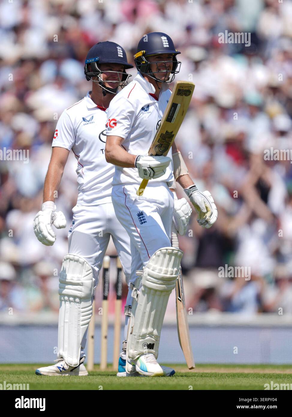 England's Matt Fisher celebrates reaching 50 runs on day three of the ...