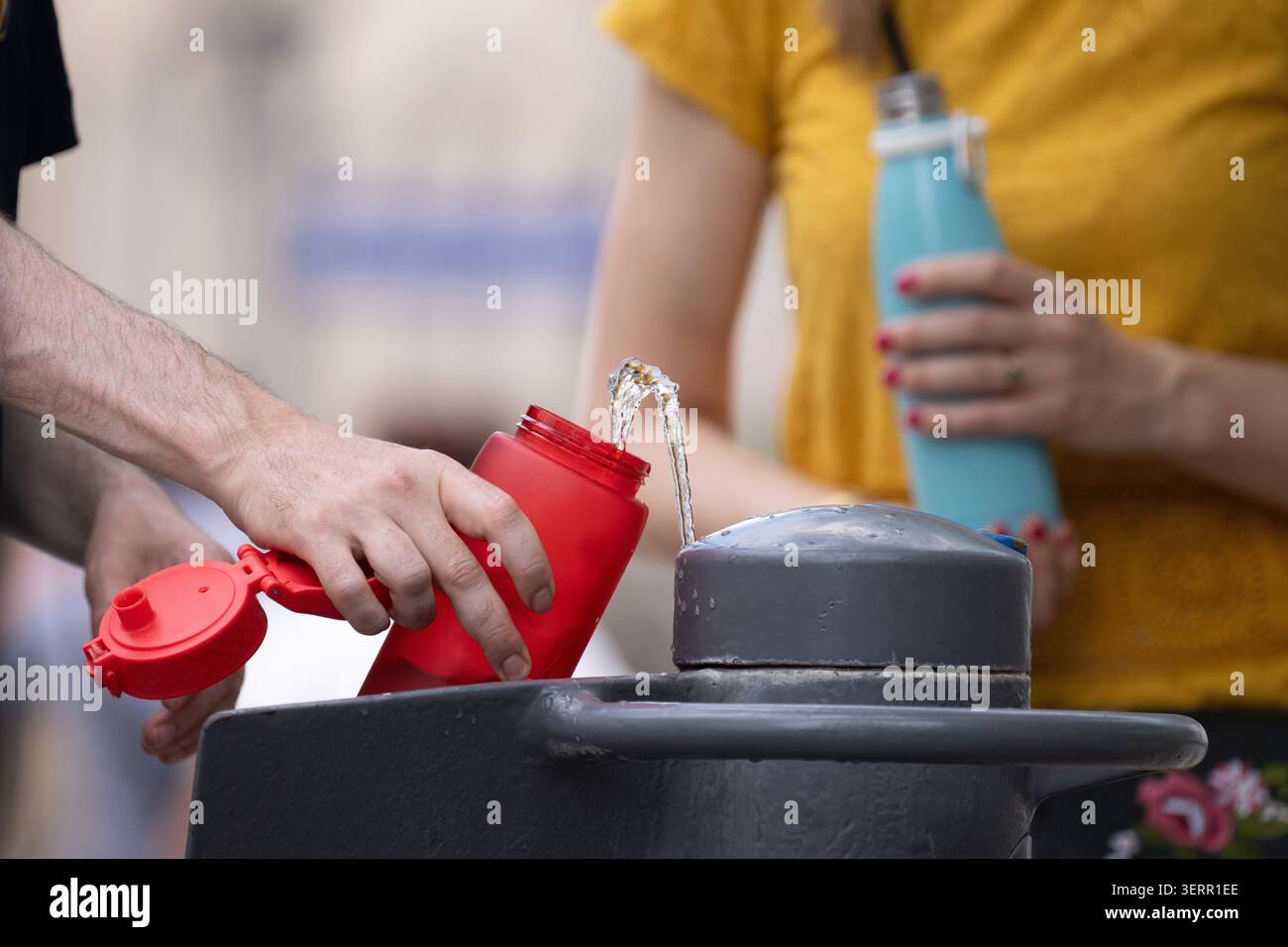 19 June 2026, Saxony, Dresden: In the hot summer weather, passersby ...