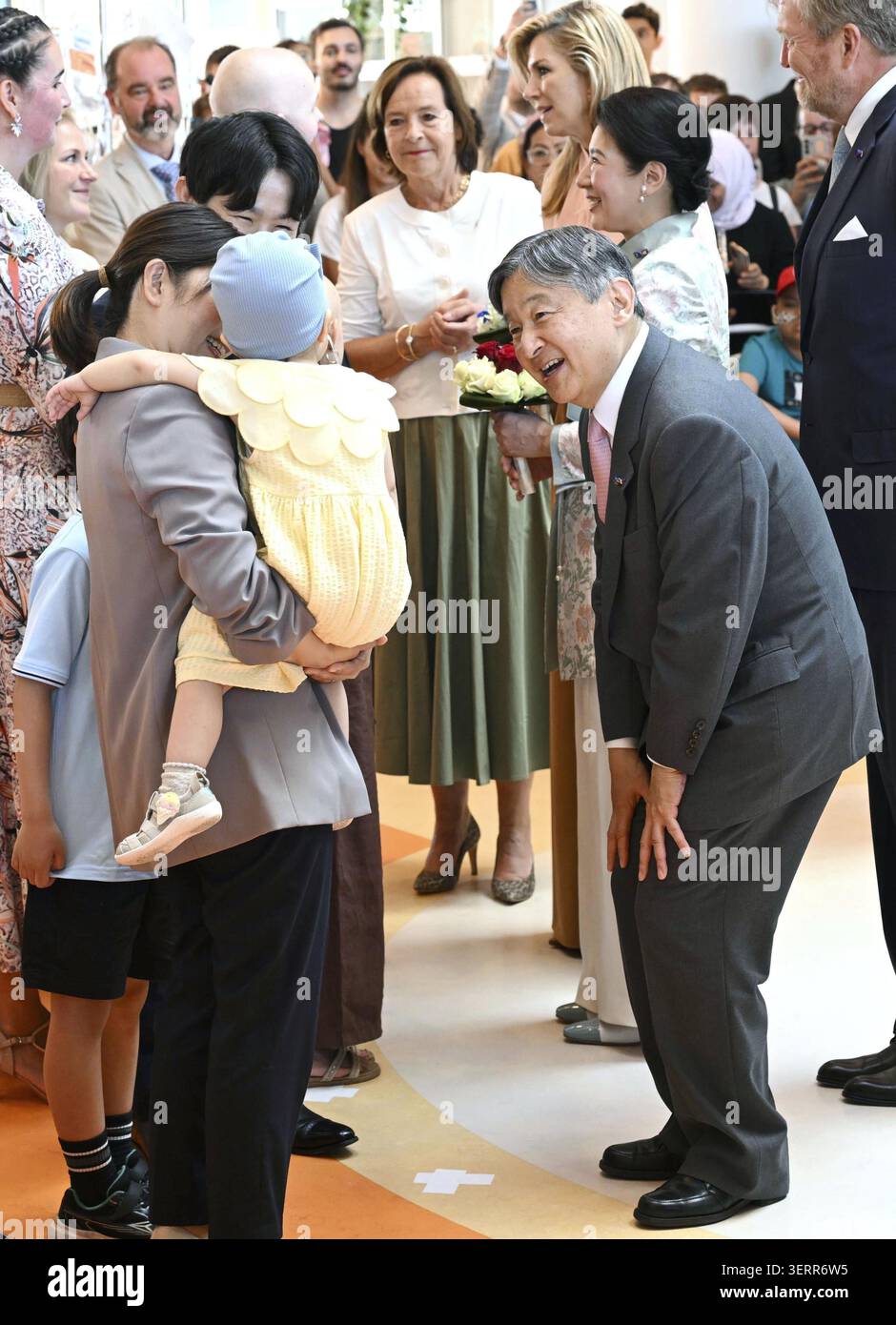 Japan's Emperor Naruhito (front, R) and Empress Masako (behind him ...