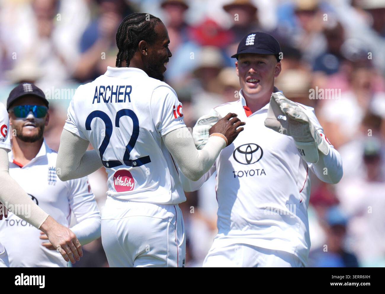 England's Jofra Archer (centre) celebrates with James Rew after taking ...