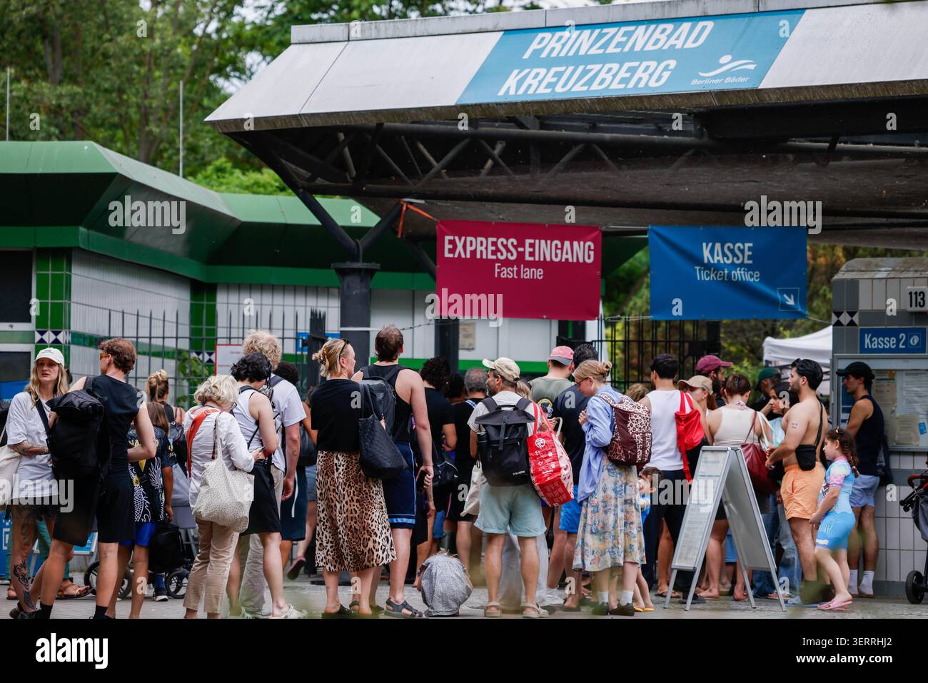 19 June 2026, Berlin: People are lining up at the entrance to the ...