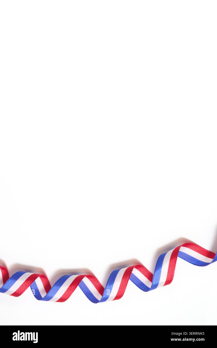 French flag colored ribbon twisted on white background in a design with ...