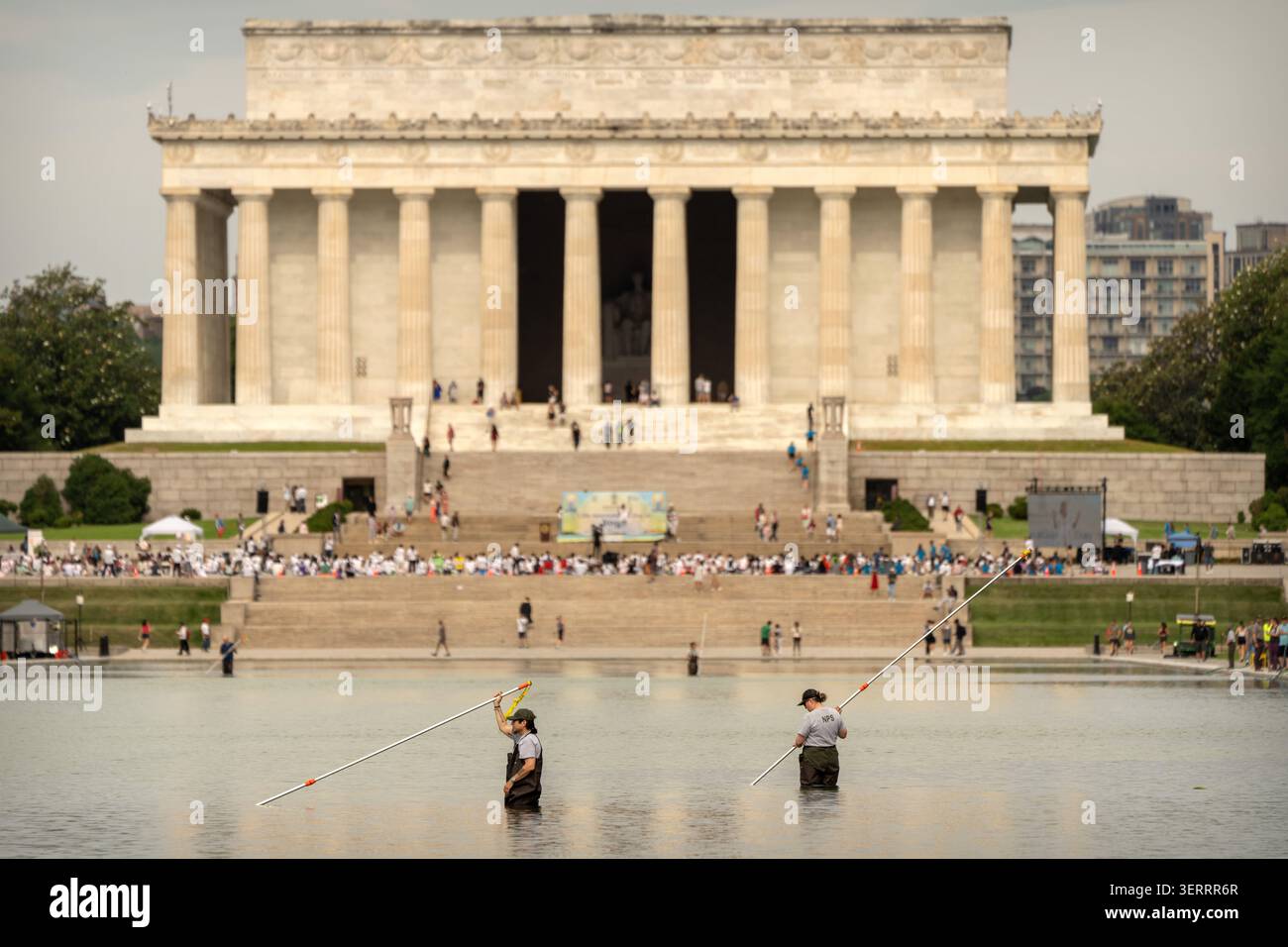 National Park Service employees use vacuums to clean the Lincoln ...