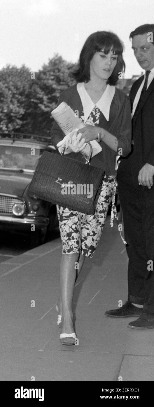 With grim determination, witness Brenda O'Neil, heads for the Old ...