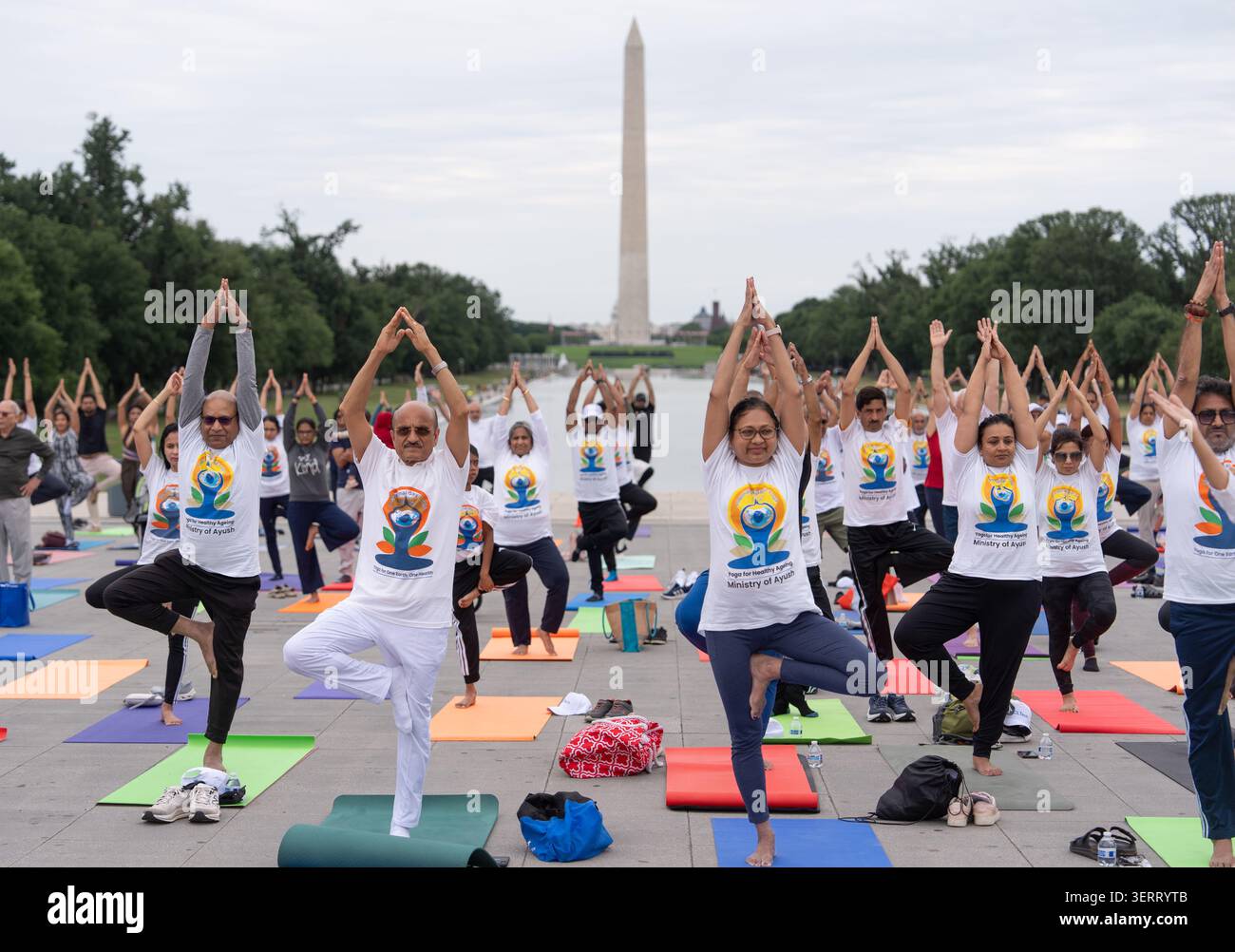 People perform yoga near the Lincoln Memorial as part of commemorations ...