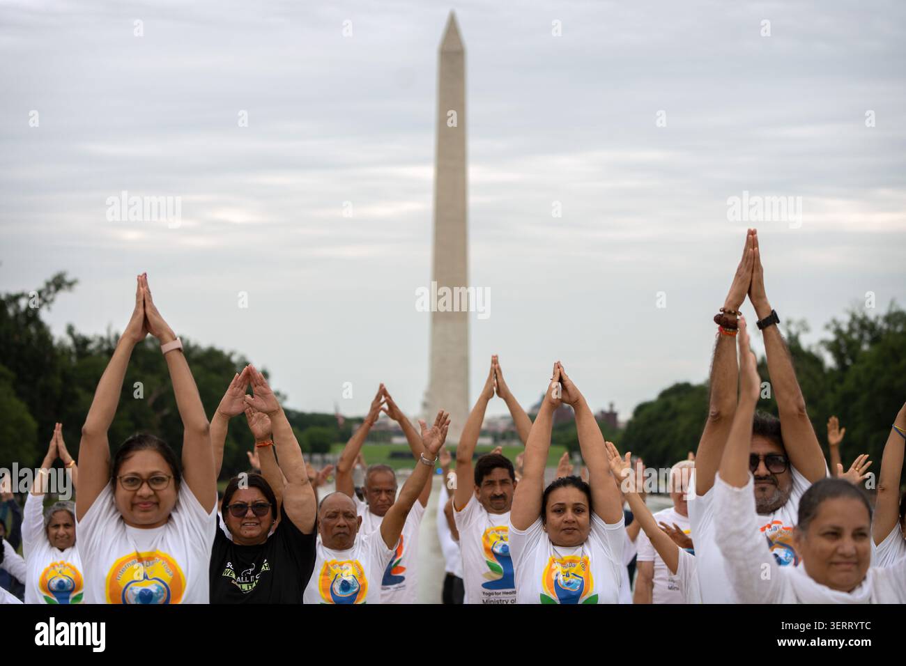 People perform yoga near the Lincoln Memorial as part of commemorations ...