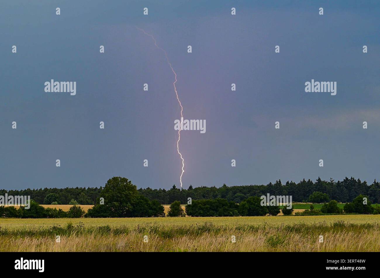Petersdorf, Germany. 19th June, 2026. A flash of lightning illuminates ...