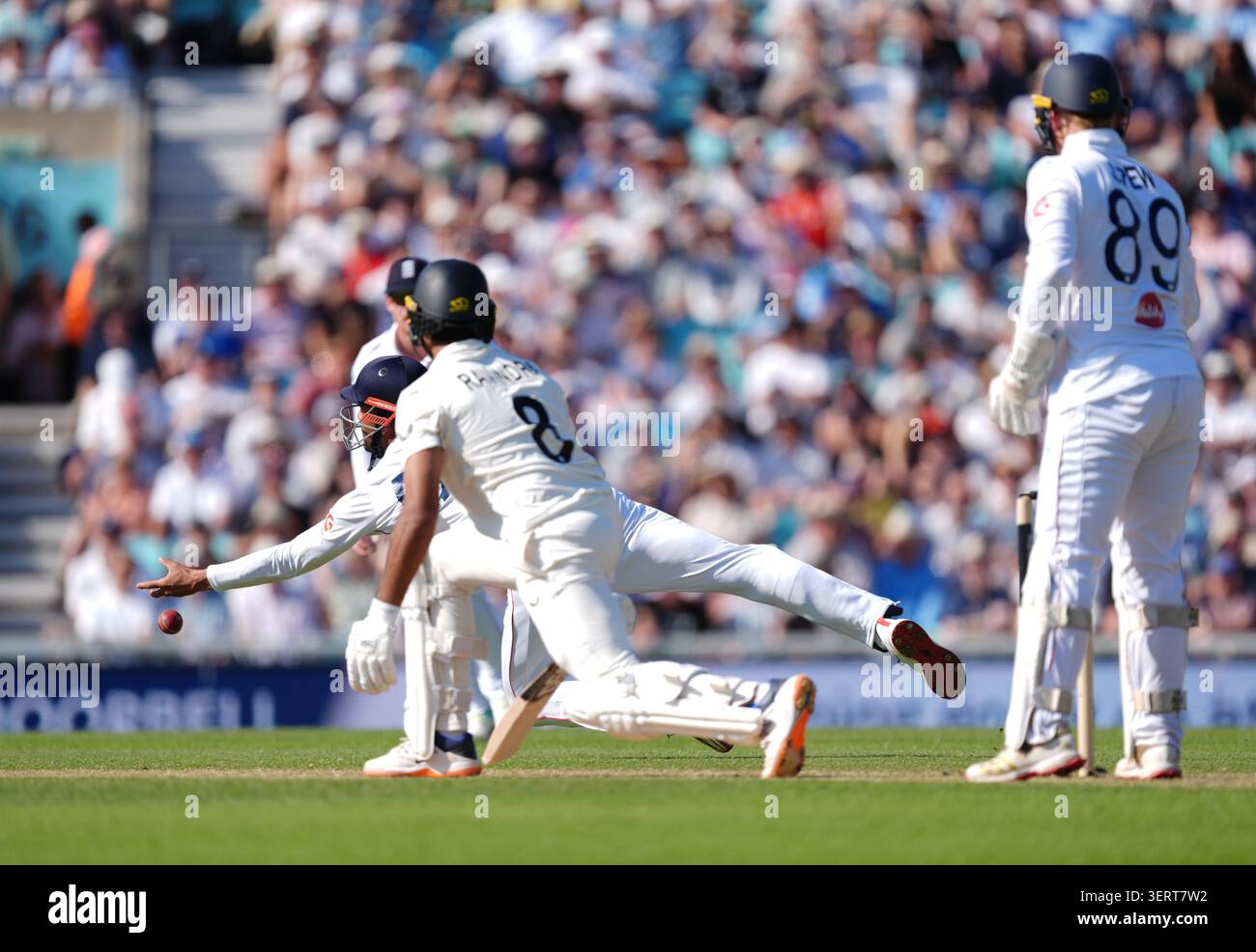 England's Emilio Gay fails to take the catch of New Zealand's Rachin ...