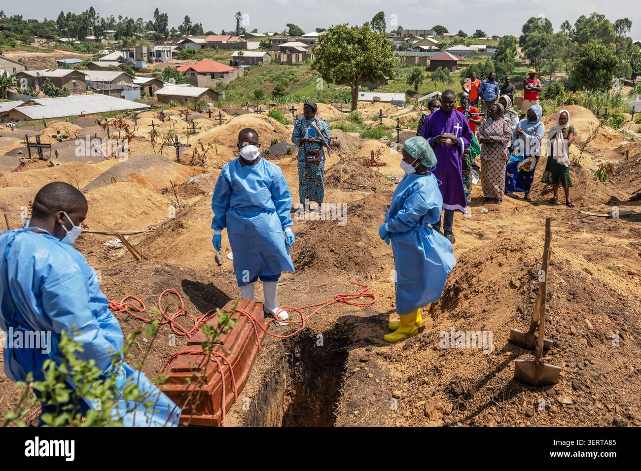 Red Cross workers prepare to bury Vanisa Anifa, a 6-month-old orphaned ...