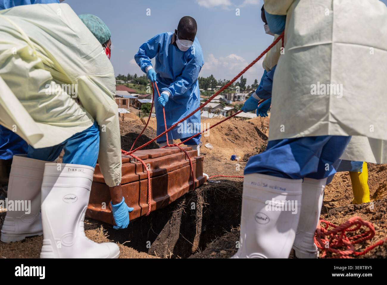Red Cross workers prepare to bury Vanisa Anifa, a 6-month-old orphaned ...