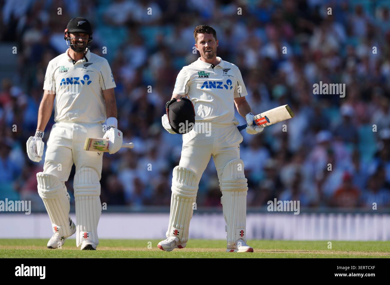 New Zealand's Henry Nicholls (right) celebrates reaching his century on ...