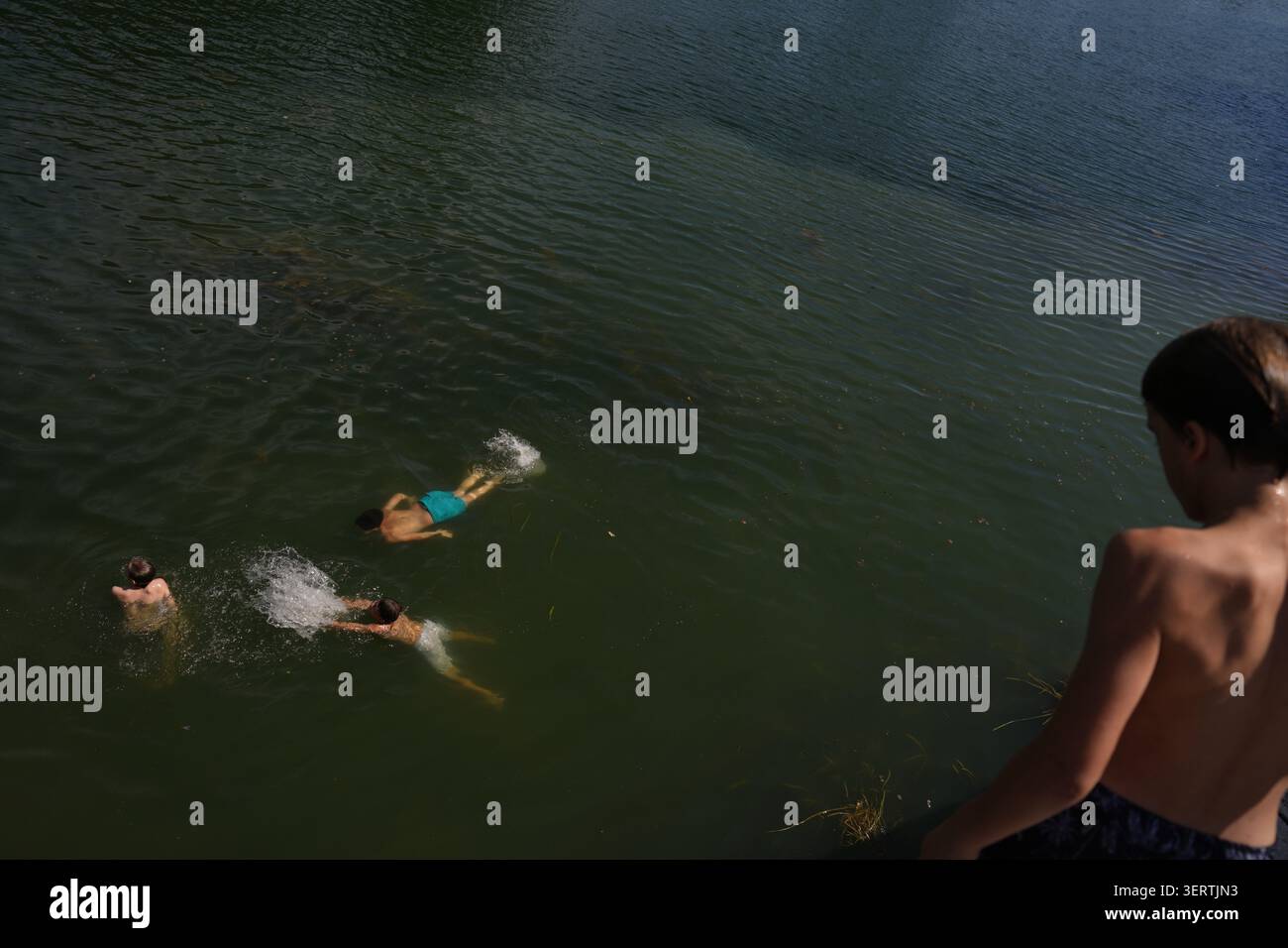 Young boys swim in the Seine river, in Samois-sur-Seine, south of Paris ...
