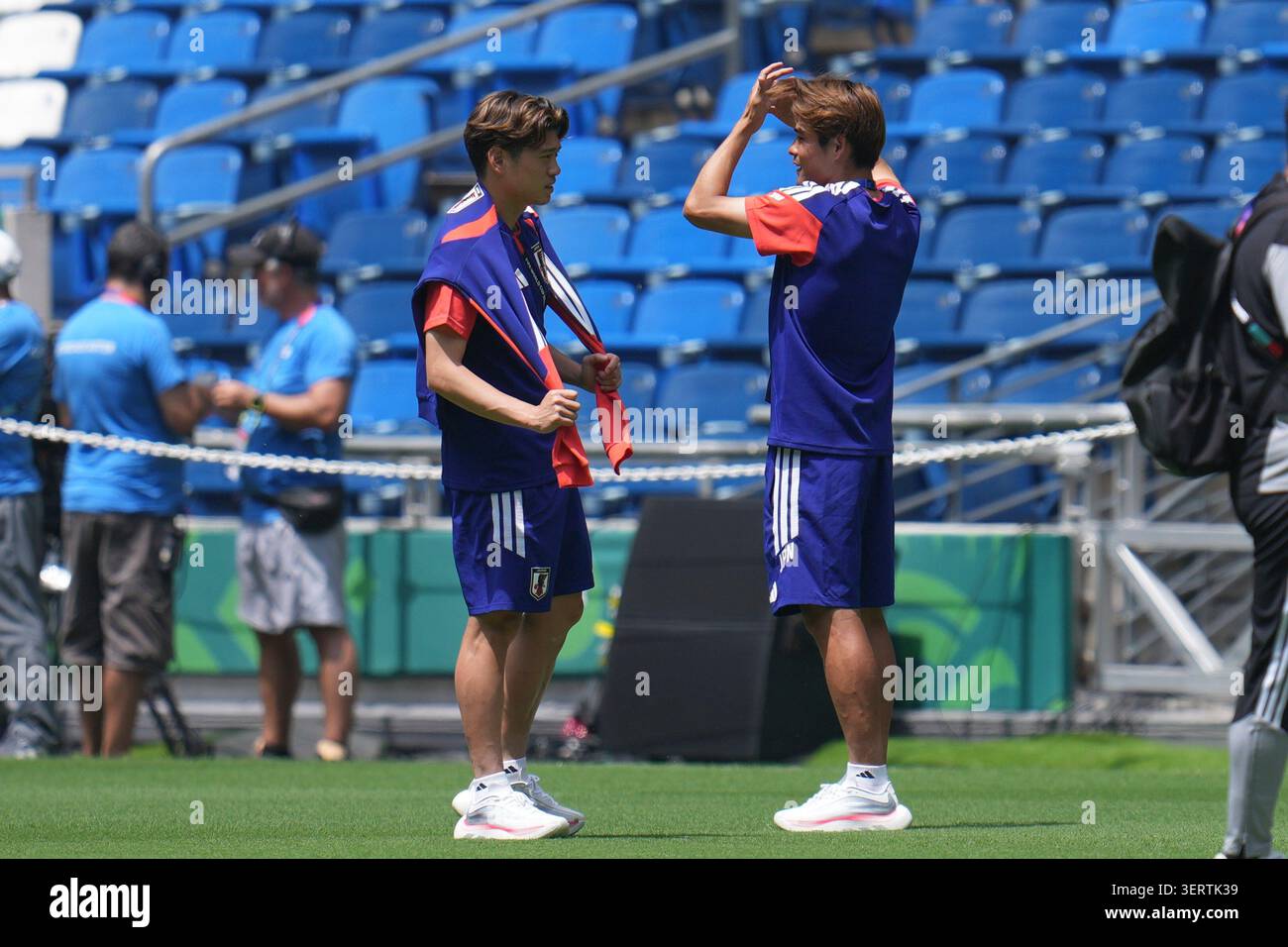 Japan's Kaishu Sano, left, and Yuito Suzuki enter to the pitch ahead of ...