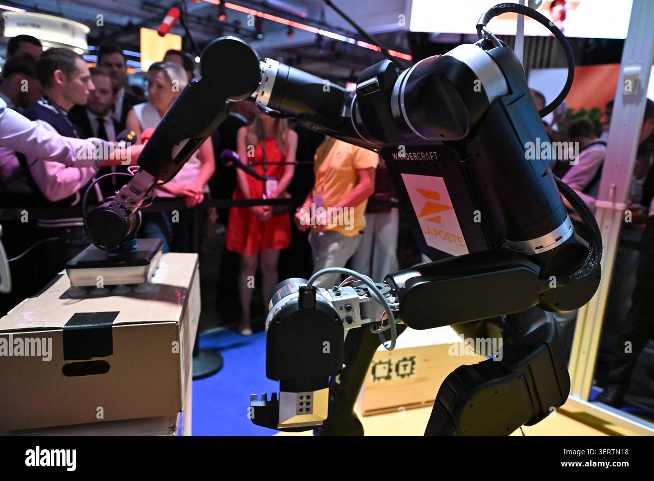 This photograph shows the VivaTech event as visitors walk around in ...