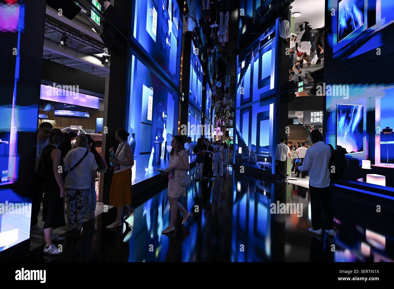 This photograph shows the VivaTech event as visitors walk around in ...