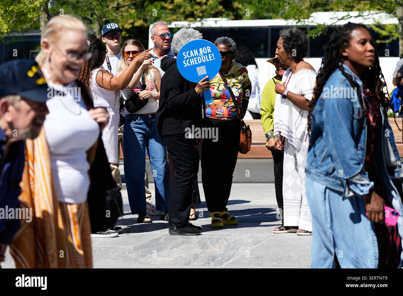 A helper assists visitors at the Obama Presidential Center, Friday ...