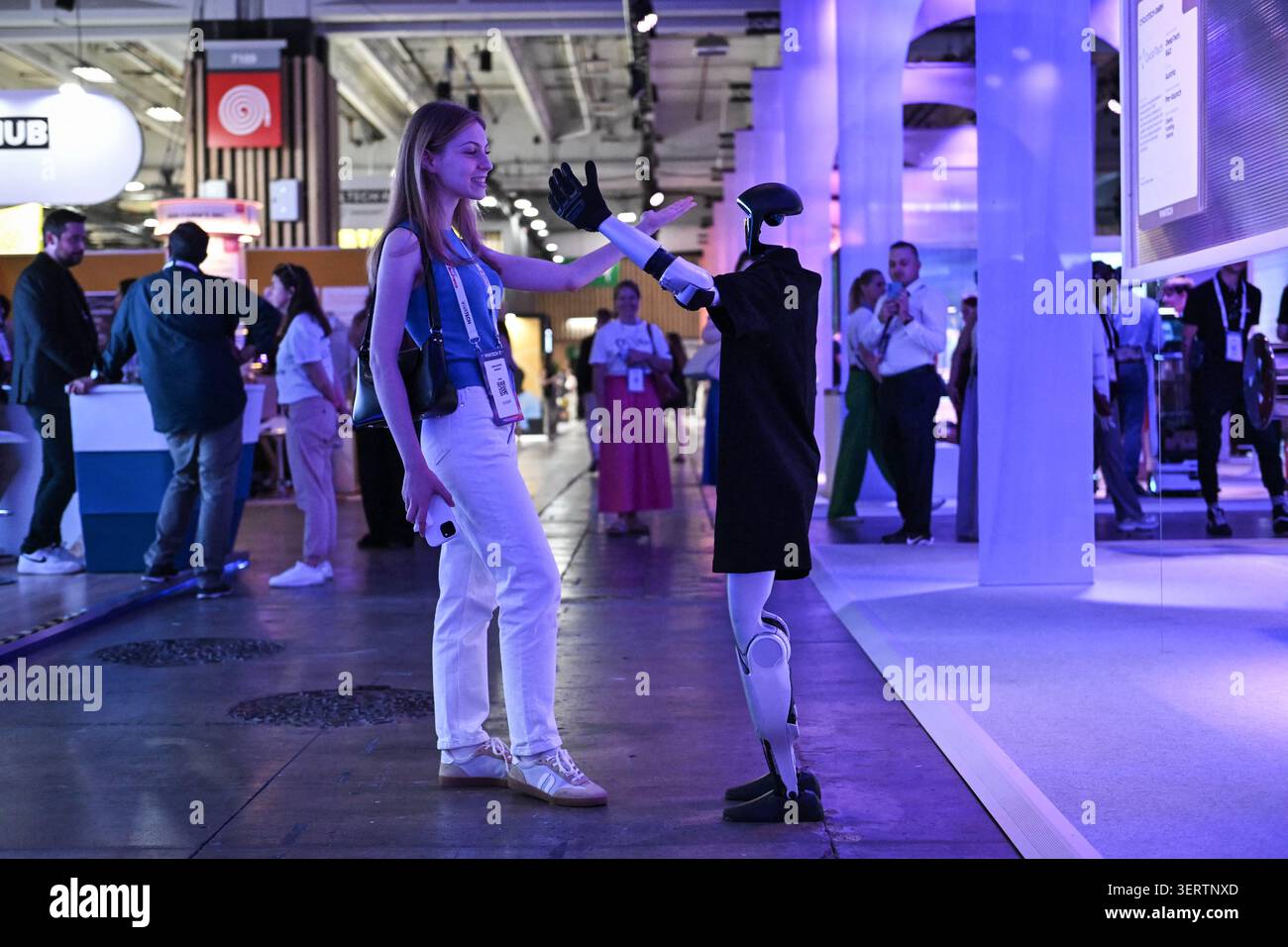 This photograph shows the VivaTech event as visitors walk around in ...