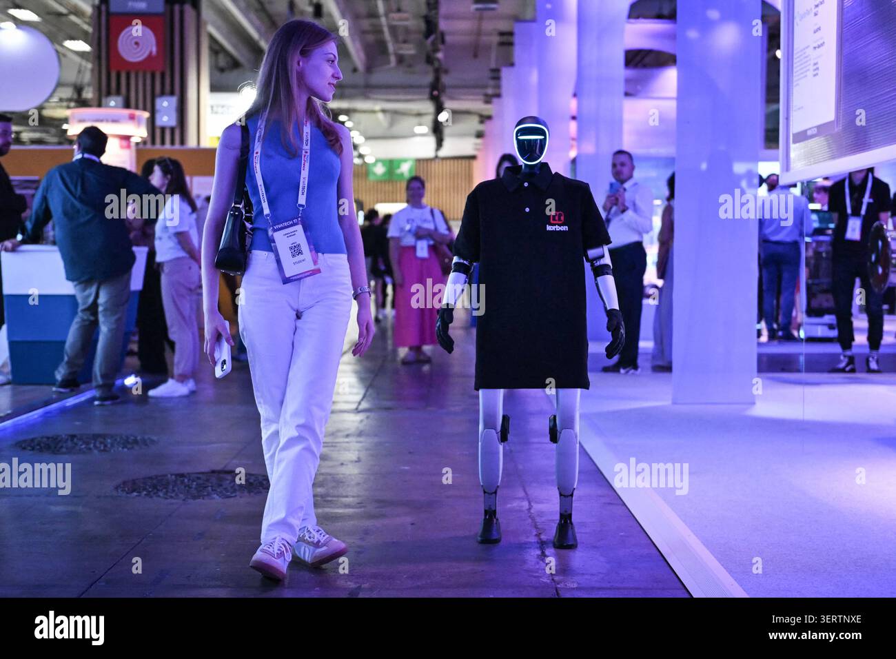 This photograph shows the VivaTech event as visitors walk around in ...