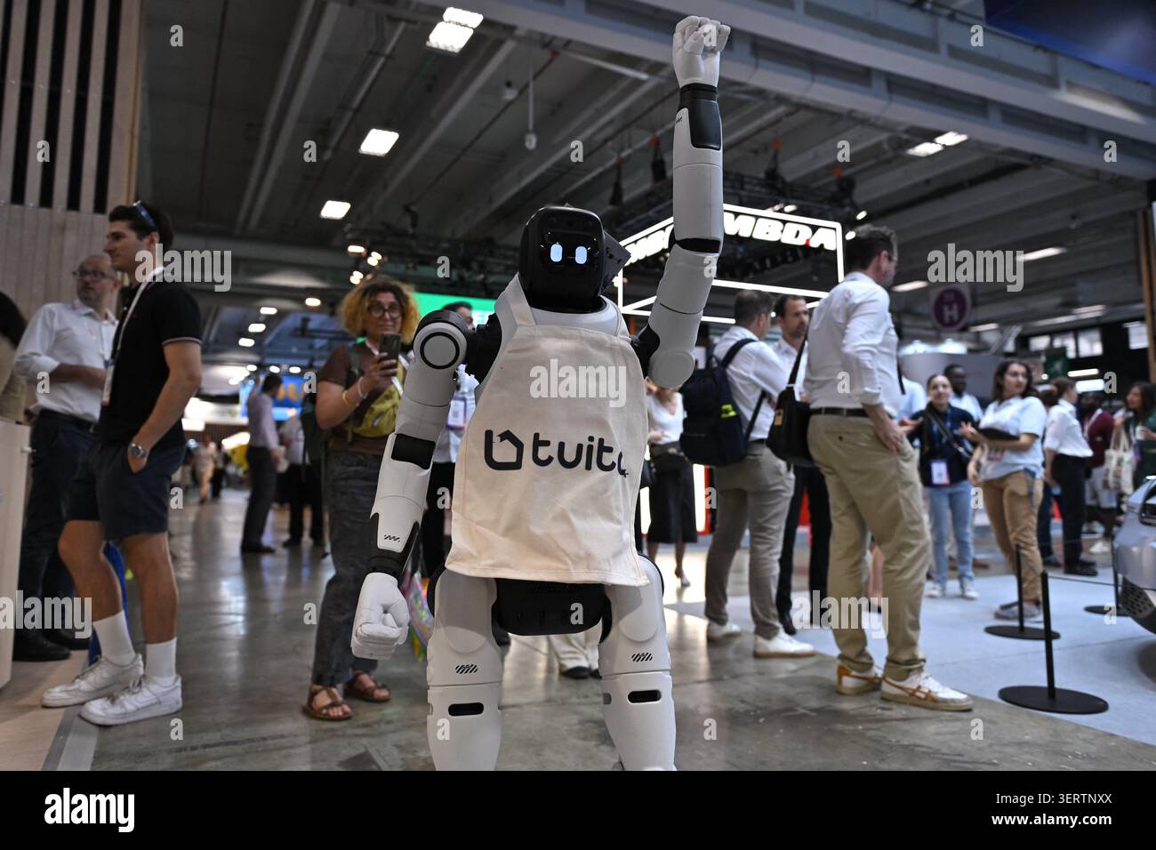 This photograph shows the VivaTech event as visitors walk around in ...