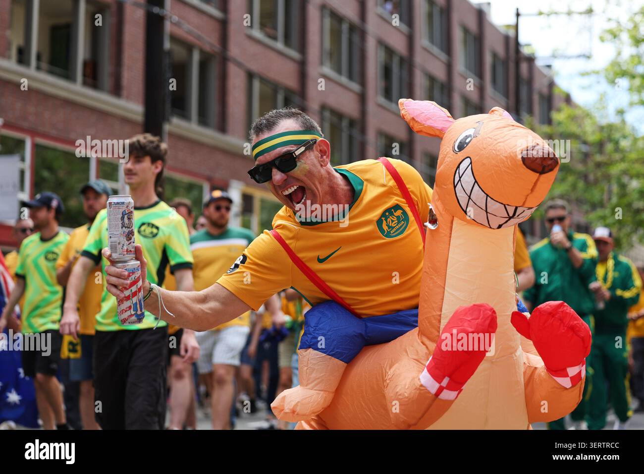 An Australian fan celebrates as fans march to match before the World ...
