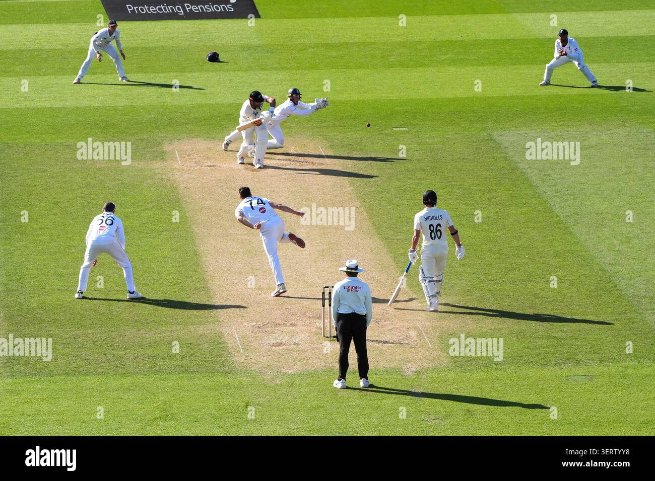 England's Matthew Fisher bowls to New Zealand's Daryl Mitchell on day ...