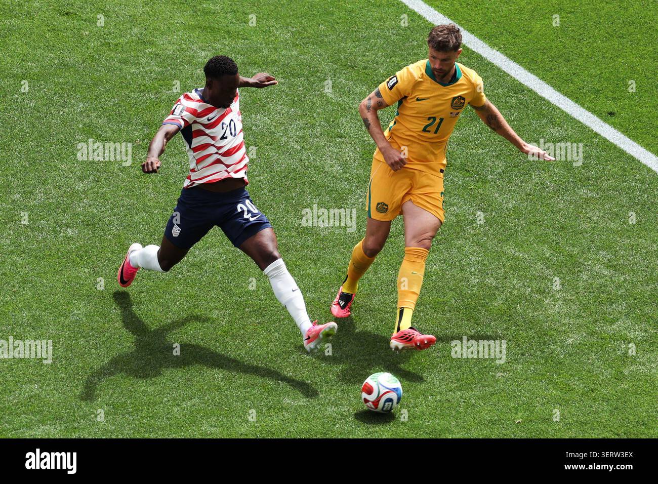 United States' Folarin Balogun (20) and Australia's Cameron Burgess (21 ...