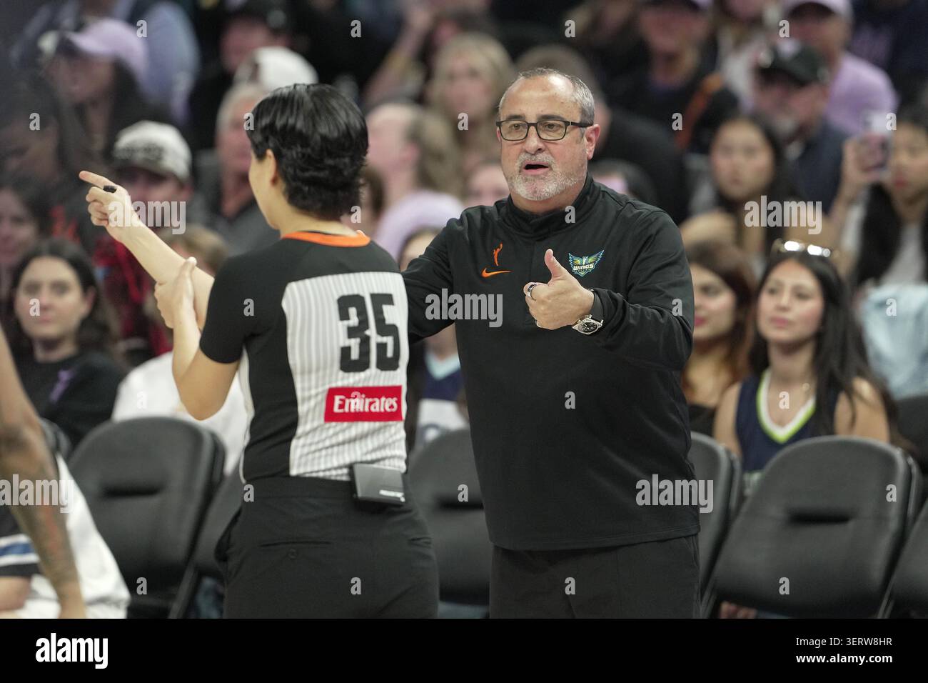 Dallas Wings head coach Jose Fernandez asking referee Catherine Chang ...