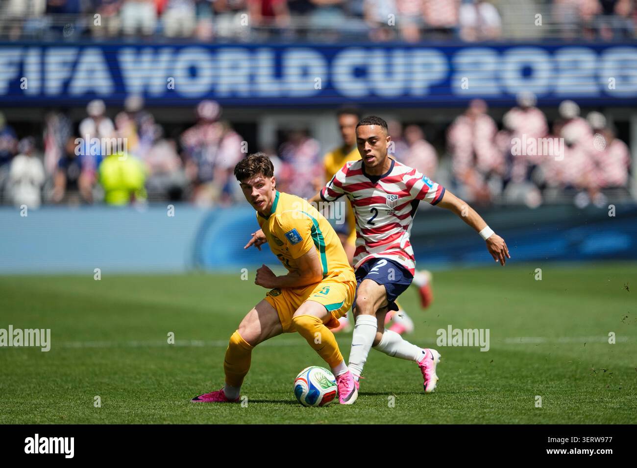 Australia's Jordan Bos shield the ball from United States' Sergino Dest ...