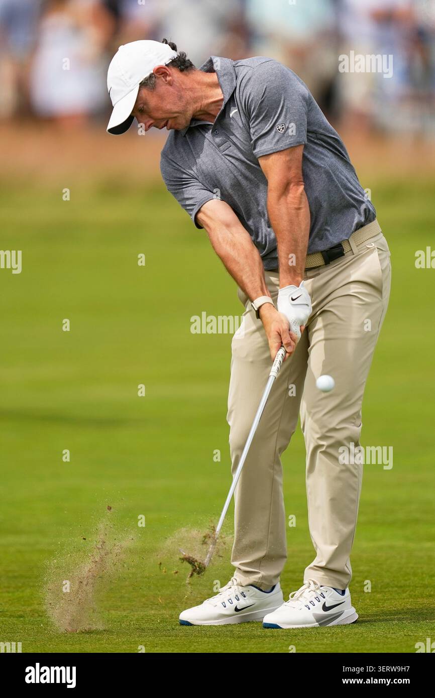 Rory McIlroy, of Northern Ireland, chips to the green on the fourth ...