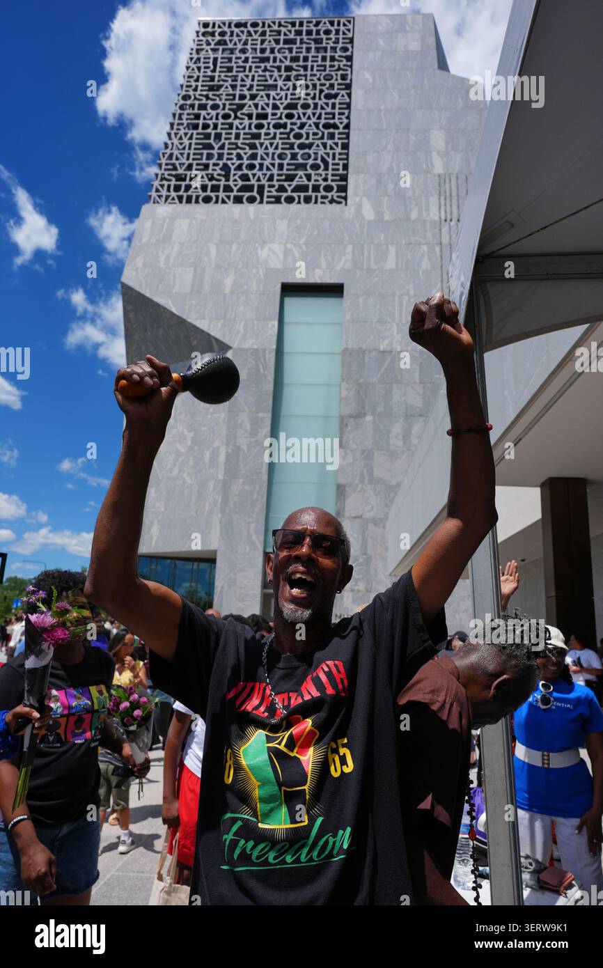 Pierre Andre Evans dances in front of Museum building at the Obama ...