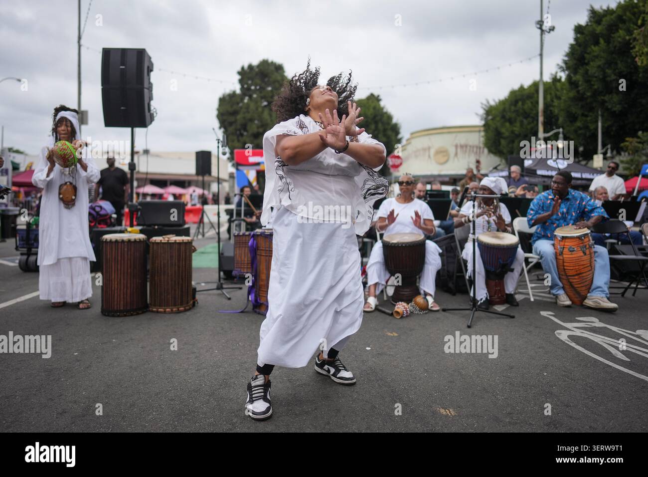 Jennifer Knight, a member of SHINE Muwasi women's African drum circle ...