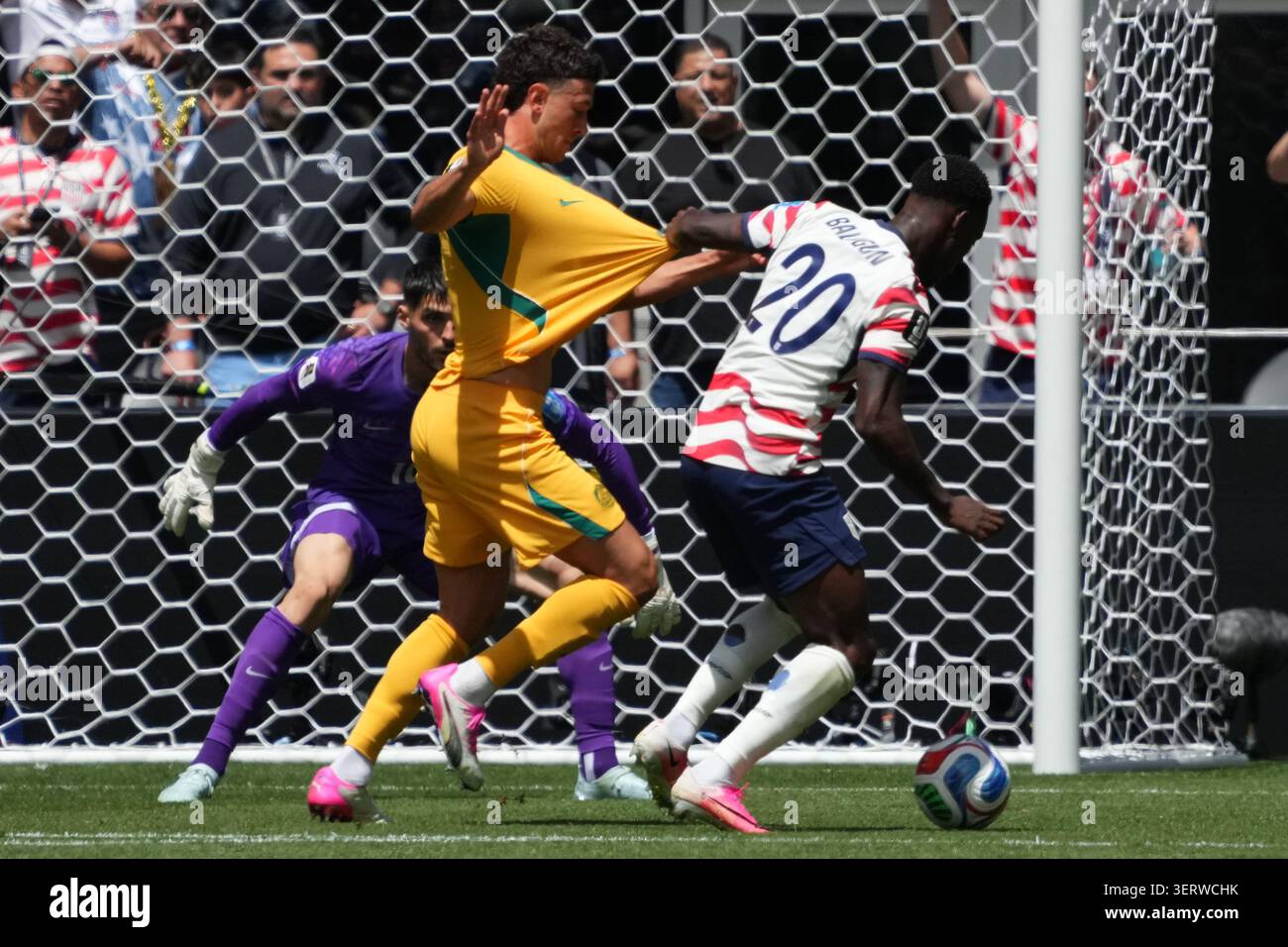 United States' Folarin Balogun (20) pulls Australia's Alessandro ...